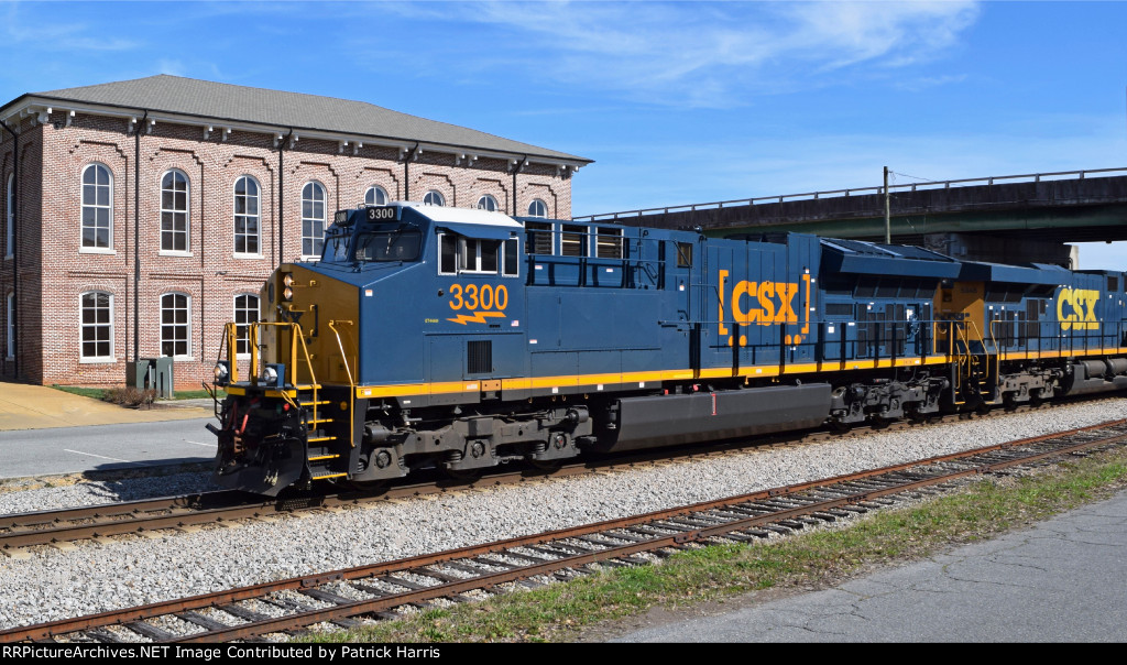 CSX 3300 ET44AH and CSX 5348 ES40DC take Q542 north through Cartersville Ga 3:11PM 03-06-2016